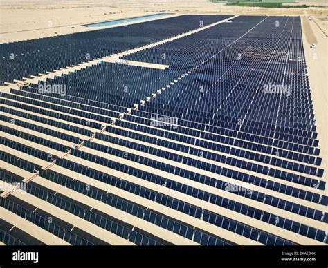 An Array Of Polycrystalline Silicon Solar Cells In Solar Power Plant Turned Up Skyward Stock