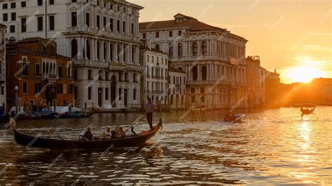 Premium Photo Gondola With Tourists Sails On Grand Canal At Sunset In