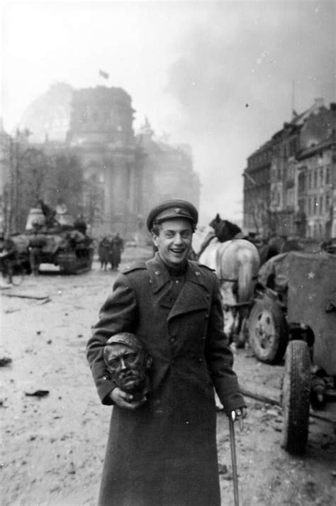 A Soviet Soldier Carries A Souvenir During The Battle Of Berlin April