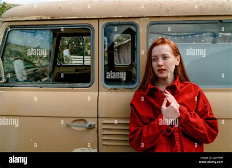 Redhead Woman Standing In Front Of Van Stock Photo Alamy