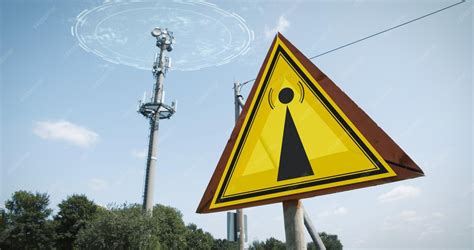 Free Photo Emf Warning Sign And A 5g Tower Causing Radiation Under A