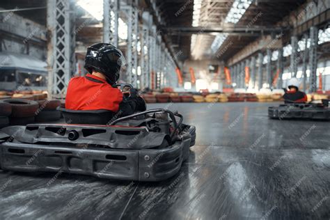 Premium Photo Racer In Helmet Driving Go Kart Car Back View Karting
