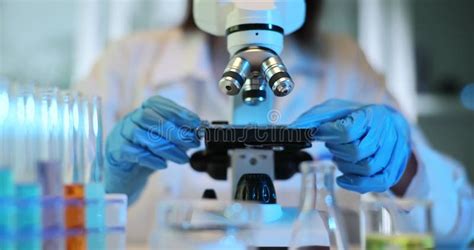 Scientist Using Microscopy Glass Setup In Laboratory Stock Footage