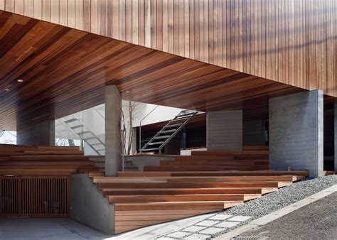 House By Kazuhiko Kishimoto With A Seating Deck And Gallery Underneath