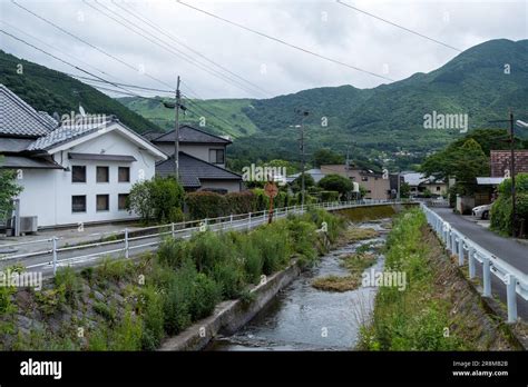 Japanese Countryside With Canal Running Through The Village And