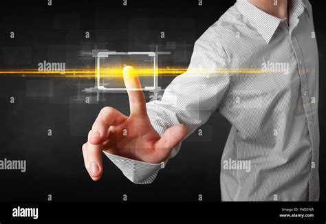 Tech Business Person Touching Button With Orange Light Beams Concept