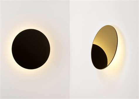 Ross Gardams Polar Wall Lamp Pivots To Create Rings Of Light