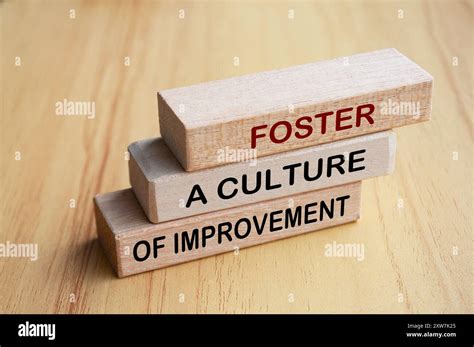 Foster A Culture Of Improvement Text On Wooden Blocks Operational Excellence And Continuous