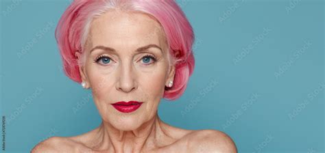 Portrait Of A Naked Woman 60 Years Old With Pink Hair And Blue Eyes On