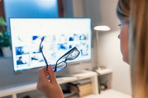 Premium Photo Young Serious Woman Wearing Glasses Looking At Pc