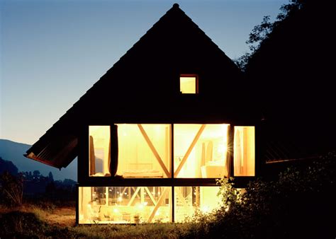 Swiss House By Pascal Flammer With Wooden Braces And A Circular Window