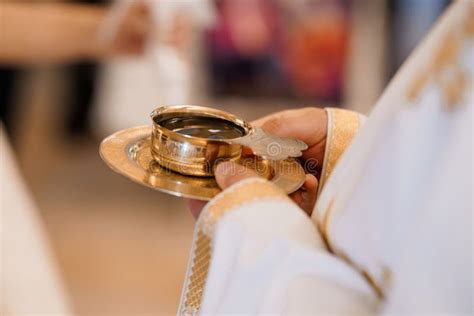 Catholic Eucharist Ceremony Priest Presenting Golden Chalice With Wine