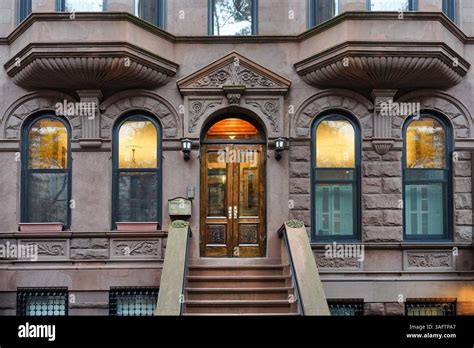 Front Of Old New York City Brownstone Townhouse With Oriel Windows