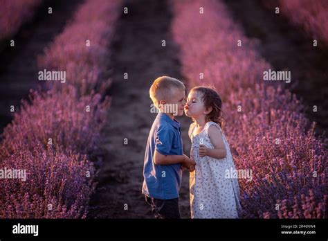 Brother Kissing His Sister On The Cheek Fotos Und Bildmaterial In