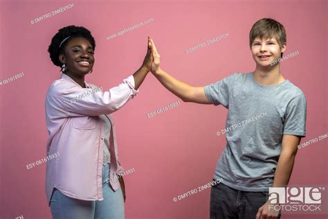 Trust Relationship Dark Skinned Woman And Caucasian Guy With Down Syndrome Standing Opposite