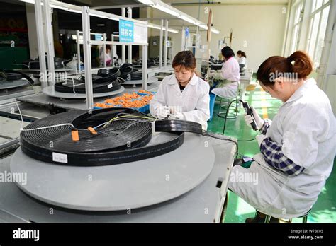 File Female Chinese Workers Produce Cables On The Cable Assembly