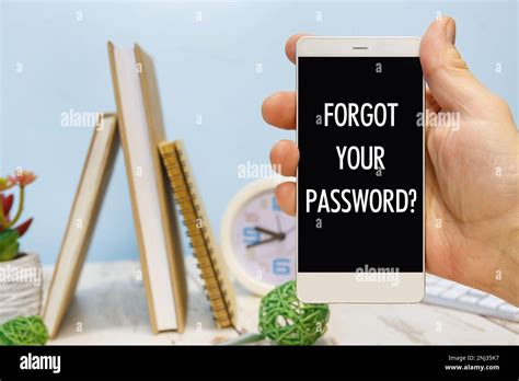 Smartphone In Hand With The Inscription Forgot Your Password Next To