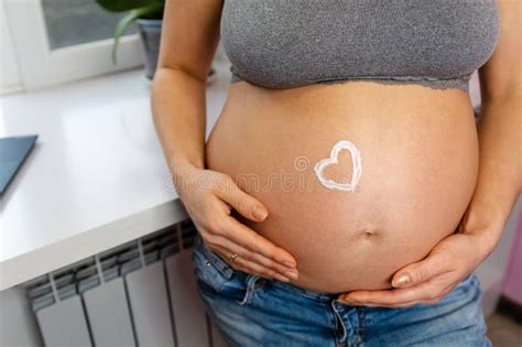 The Gentle Embrace Captures The Essence Of Maternal Anticipation And Joy Stock Photo Image Of