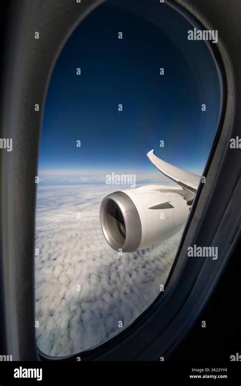Window View Of The Right Wing And Engine Of A Boeing B787 1000