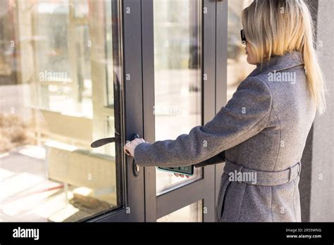 Female Entering Secret Key Code For Getting Access And Passing Building Using Application On