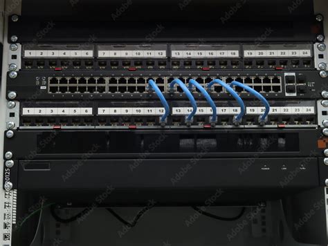 An Ethernet Switch And Patch Panels Installed In A Low Current Rack Stock Photo Adobe Stock