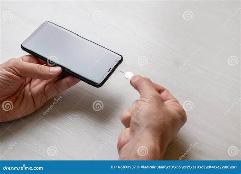 Eject Sim And Mini Sd Card From Phone With Pin Ejector Tool Stock Image Image Of Port Memory