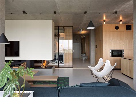 Olga Akulova Installs Monolithic Fireplace Within Kyiv Penthouse