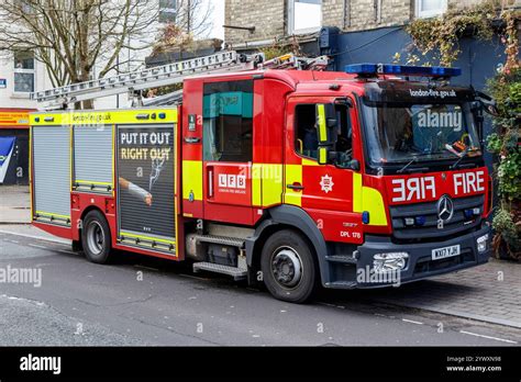 A London Fire Brigade Fire Engine Parked By The Roadside In North