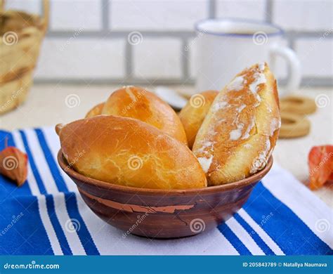 Homemade Baked Pies From Yeast Dough With Meat In A Brown Clay Bowl On