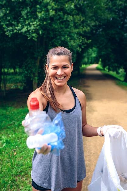 Premium Photo Girl Showing Garbage She Has Collected