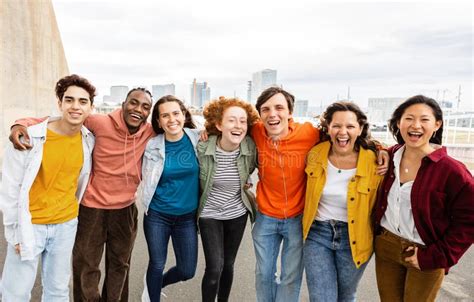 Group Portrait Of Multiracial Young Friends Outdoors In Summer Stock