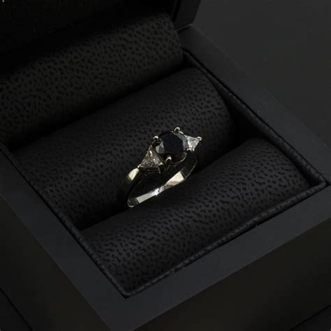 Palladium Claw Set Trilogy Ring With Round Black Diamond And Trilliant