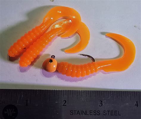 Round Jig 1 4 Oz With Orange Head And 3 3 Orange Grub Tails