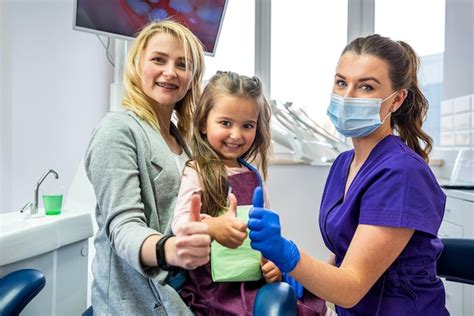 Premium Photo Mom Brought Her Little Daughter To The Dentists Office