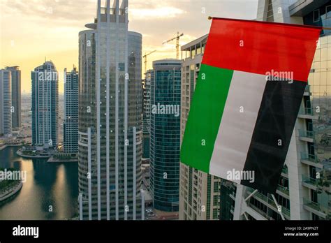 Dubai Uae November 16 2019 Uae Flag Waves On Foreground Of Dubai