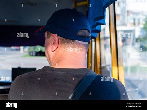 Passenger In Public Transport Close Up Of A Middle Aged Man In Baseball Cap Back View Stock
