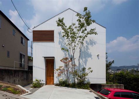House In Ikoma Has A Void That Stretches To Its Pitched Roof
