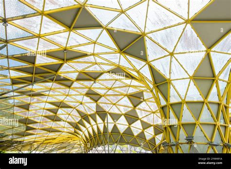 Modern Geometric Yellow Lattice Roof Structure With A Repetitive