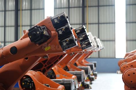Robotic Arm In Futuristic Assembly Manufacturing Factory In Factory Shop Floor Stock Image