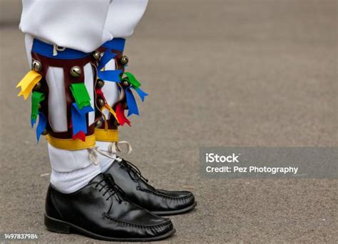 Morris Dancer Wearing Leg Bells At Kirtlington Lamb Ale Morris Dancing Festival In Oxfordshire