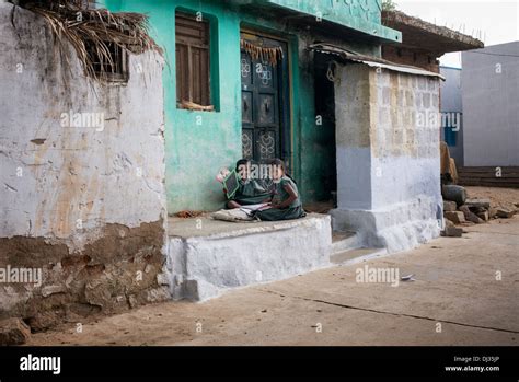 Young Indian Girls Doing School Work Outside Their Rural Indian Village