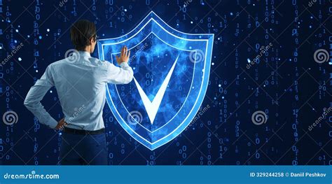 Man Interacting With A Digital Shield On A Binary Code Background Representing Cyber Security