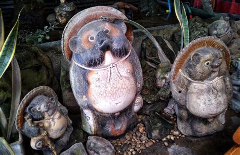Japanese Tanuki Statue In A Traditional Garden In Kyoto Japan