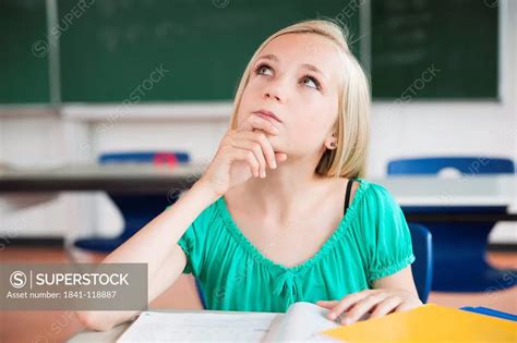 Teenage Girl In Classroom Thinking Superstock
