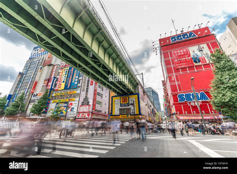 Colorful Bilboard Advertisements Motion Blurred Crowd At Chuo Dori Street And Sobu Sen Line