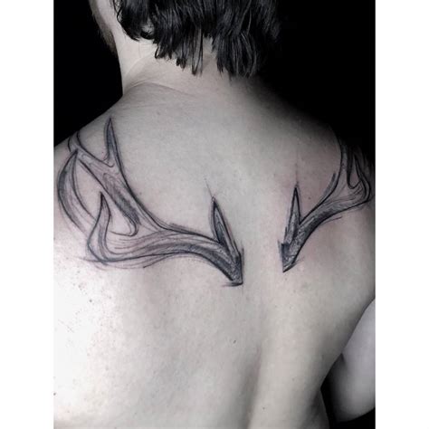 Sketch Work Style Antlers Tattooed On The Back