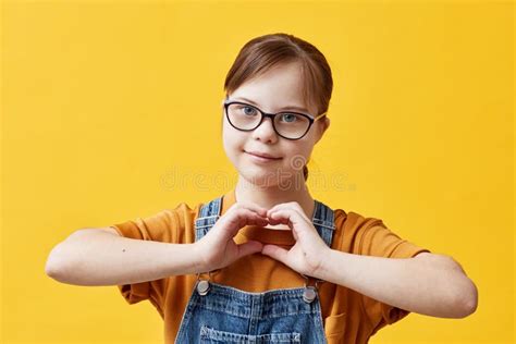 Girl With Down Syndrome Daydreaming By Window Stock Image Image Of Girl Diversity 256745893