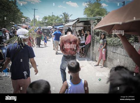 Penitents And Bleeding Flagellants Parade For Holy Week Good Friday