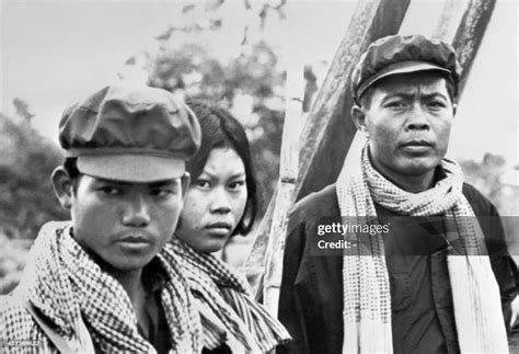 Khmer Rouge Colonel Vichai Poses With His Wife And His Deputee At