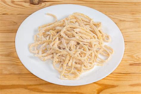 Raw Homemade Egg Noodles On A Dish On Rustic Table Stock Image Image